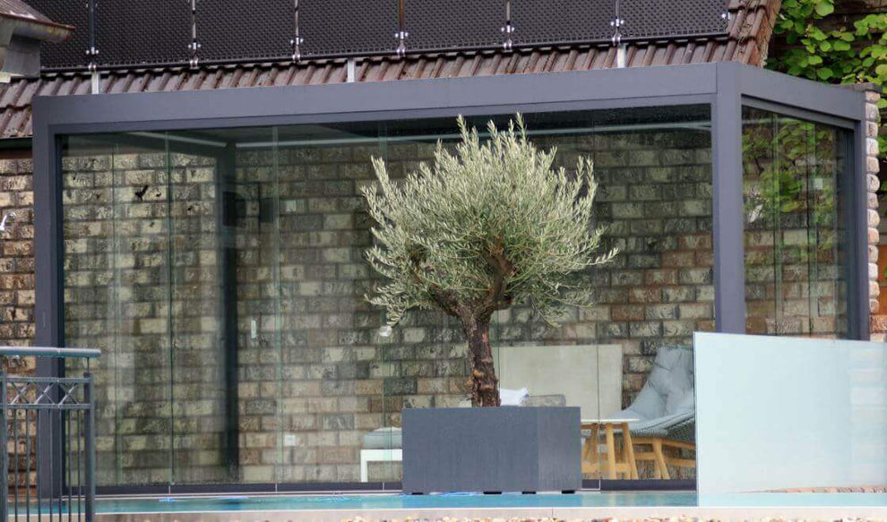 Pinela pergola glass room with tilting roof and glass sides