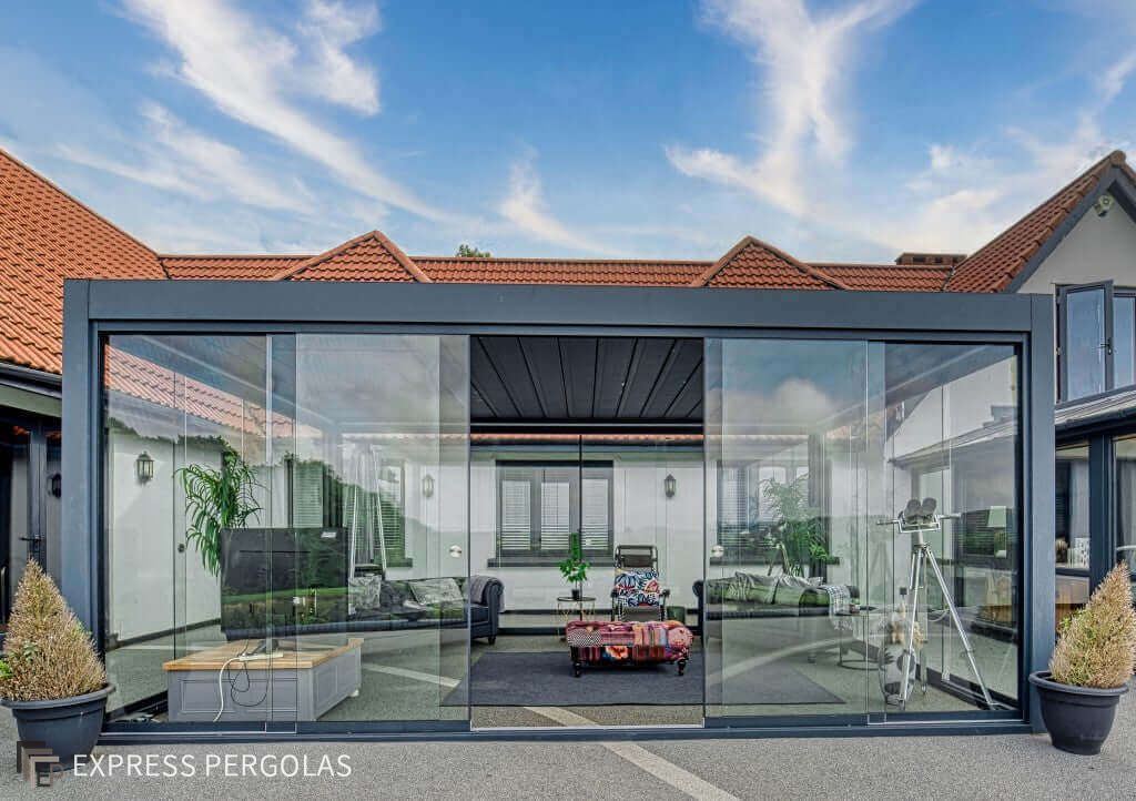 Pinela pergola glass room with tilting roof and glass sides
